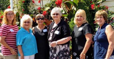 Women's club members attend district luncheon