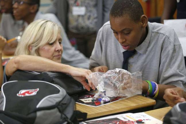 Pass It Along distributes backpacks