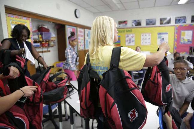 Pass It Along distributes backpacks